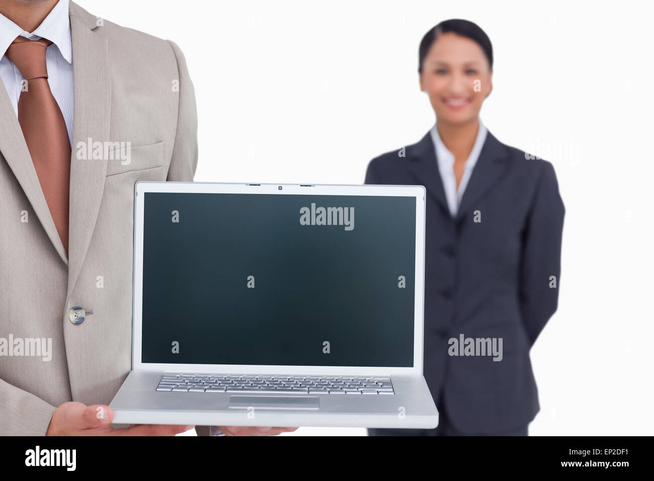 Laptop being presented by salesman with colleague behind him Stock ...