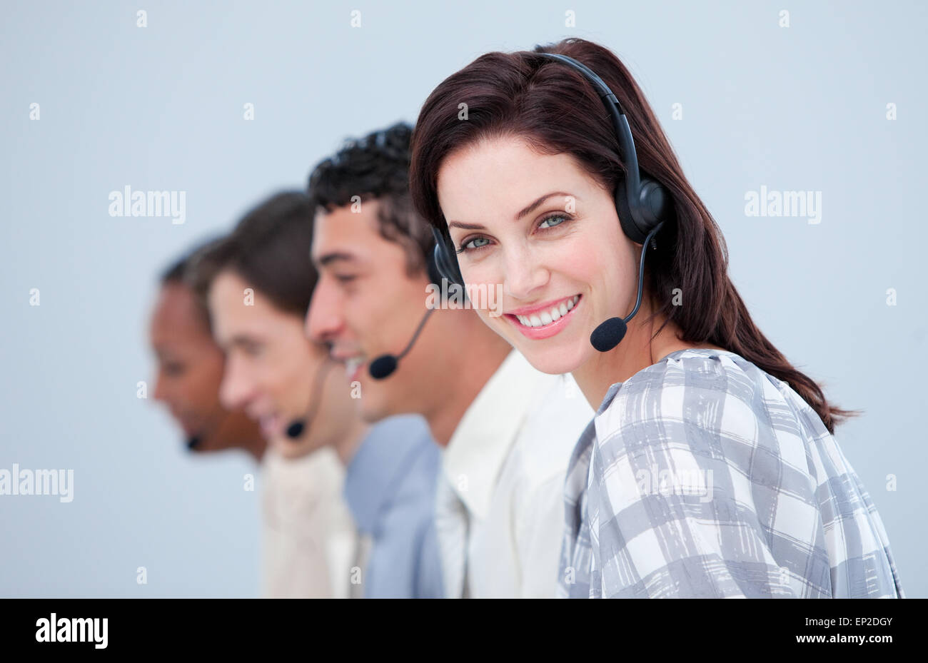 Attractive business woman and her team working in a call center Stock ...