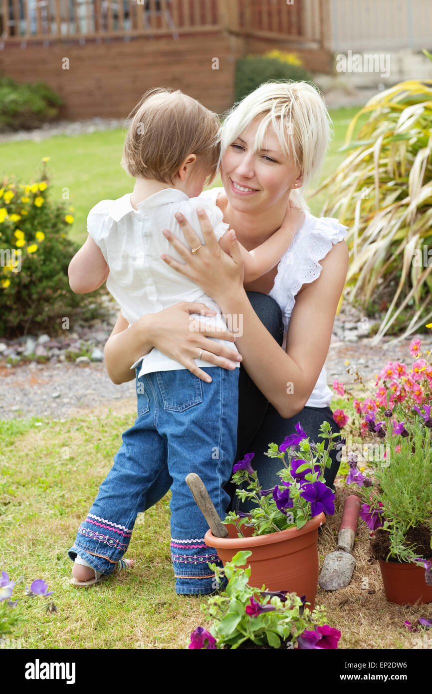 Smiling mother looking at her child Stock Photo - Alamy