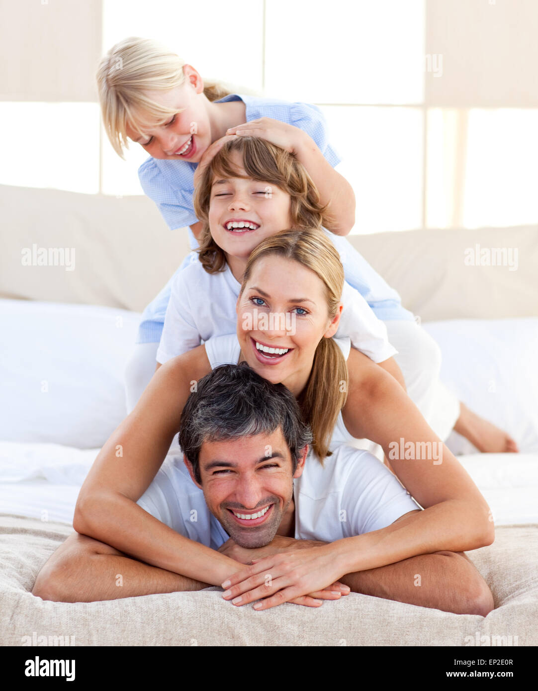Happy family having fun Stock Photo - Alamy