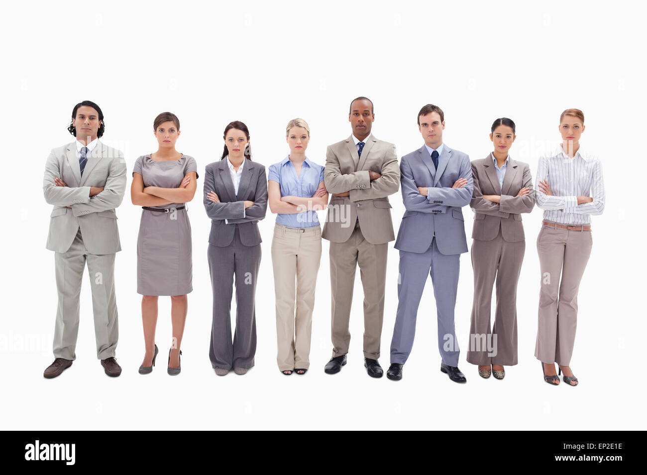 Serious business team crossing their arms side by side Stock Photo - Alamy