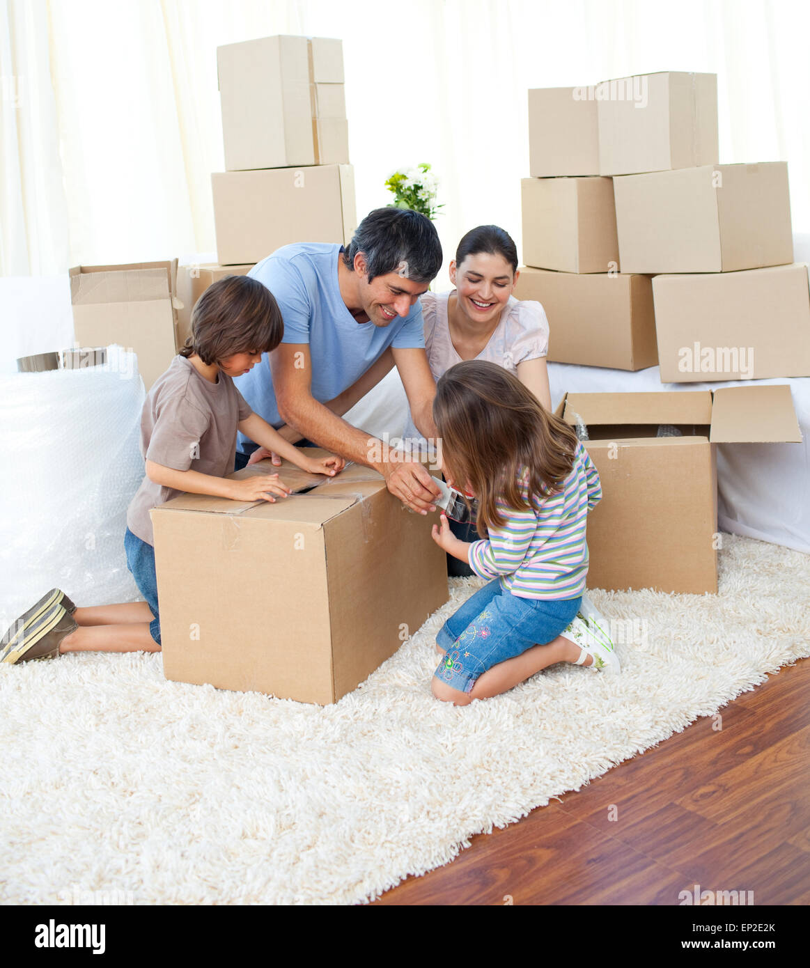 Animated family packing boxes Stock Photo - Alamy