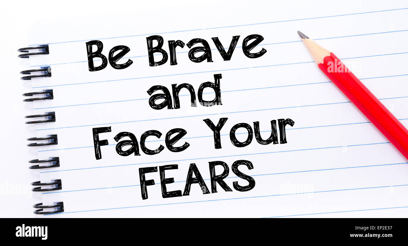 Be Brave and Face Your Fears Text written on notebook page, red pencil ...
