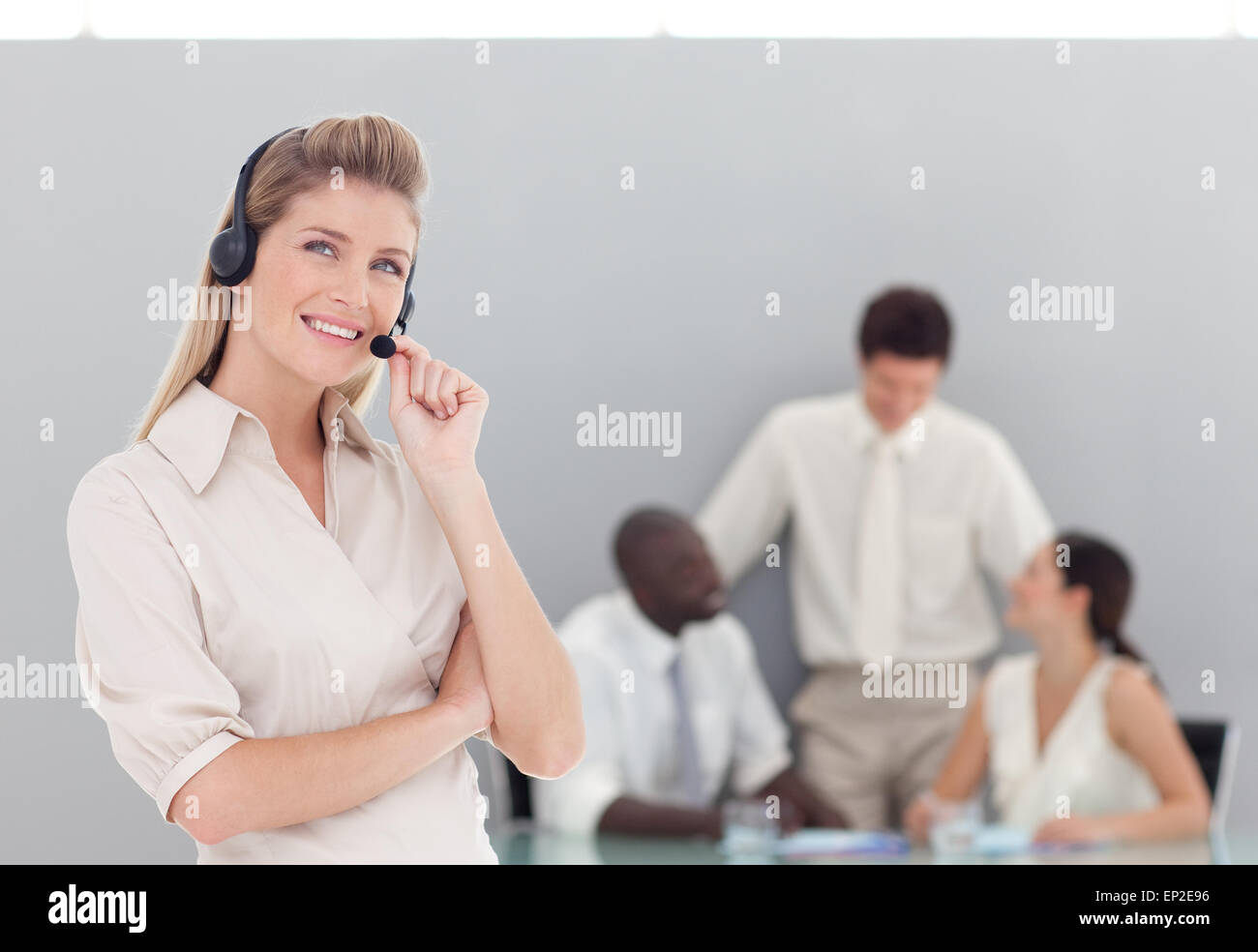 Beautiful female sales respresentative with her team Stock Photo - Alamy