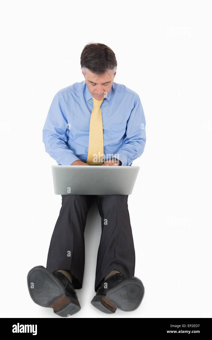 Smart dressed man sitting down hi-res stock photography and images - Alamy