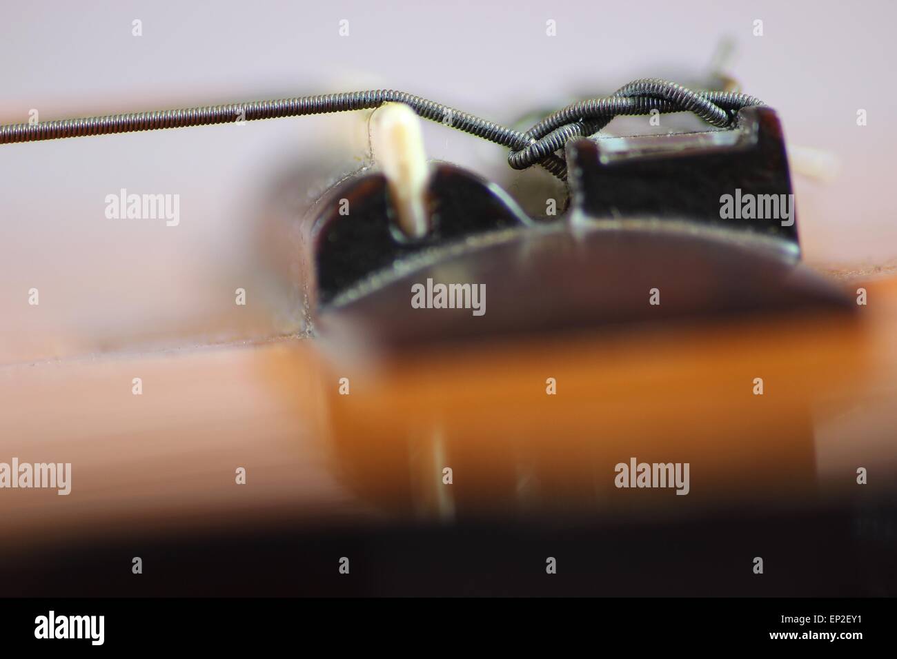 Classical guitar bridge and string close-up Stock Photo - Alamy