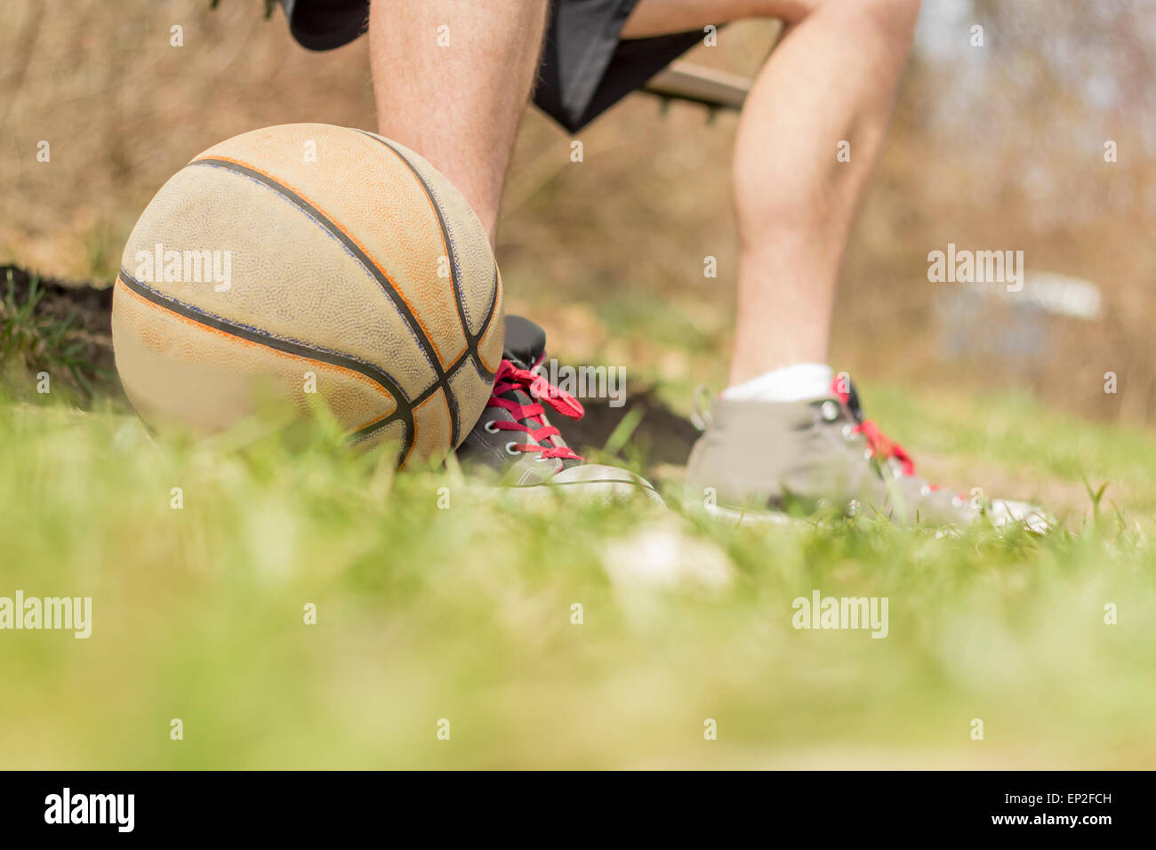 Young man resting after exhausting basketball game Stock Photo - Alamy