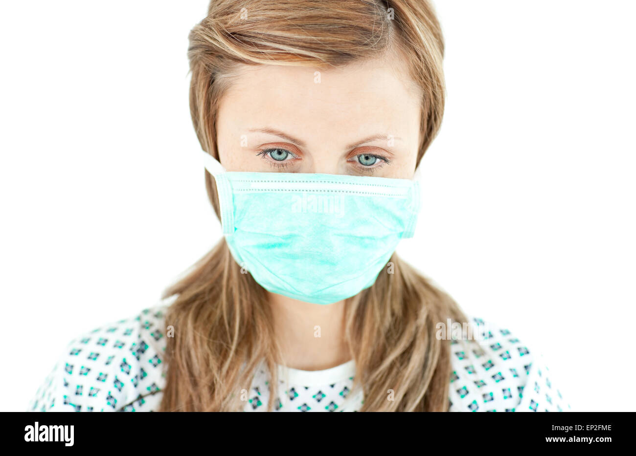 Unhappy patient looking to the floor against white background Stock ...