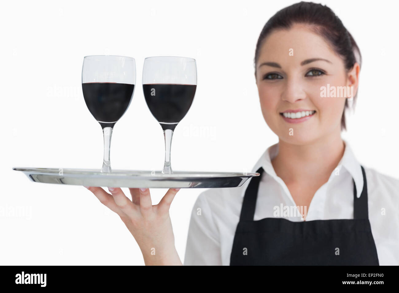 Cheerful waitress holding two glasses of wine Stock Photo - Alamy