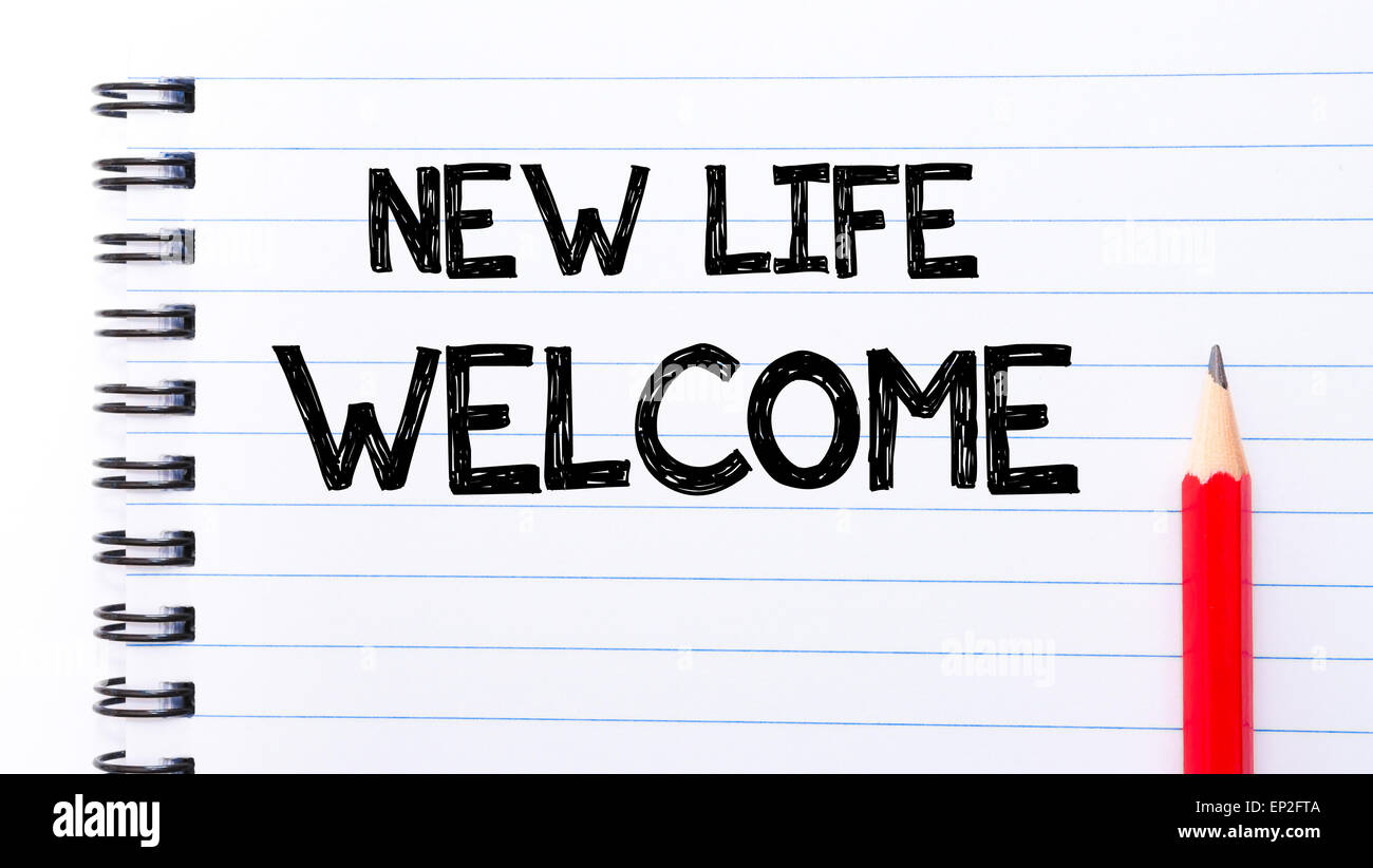 New Life Welcome Text written on notebook page, red pencil on the right ...