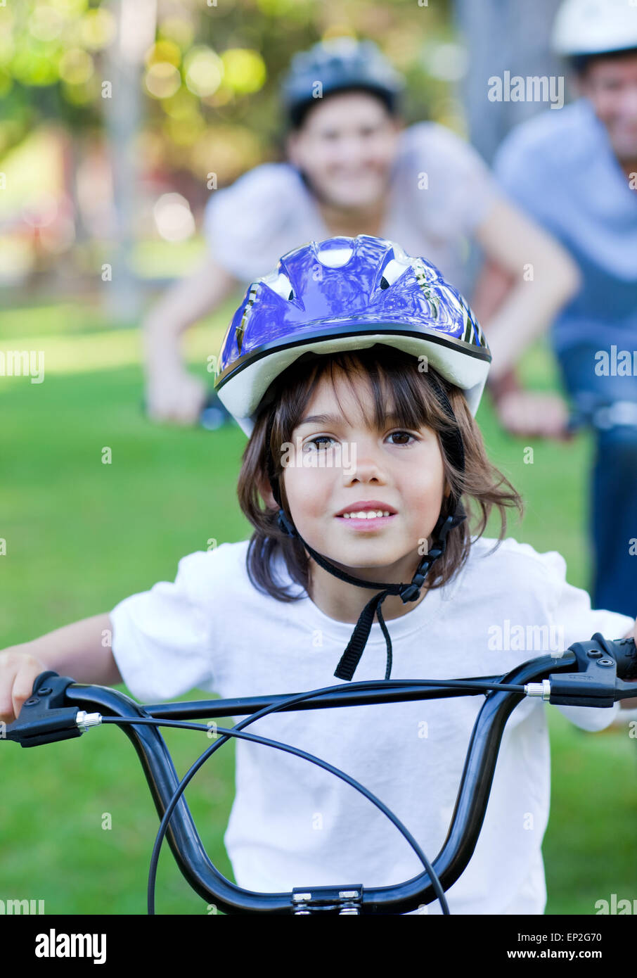 Adorable little boy riding a bike Stock Photo - Alamy