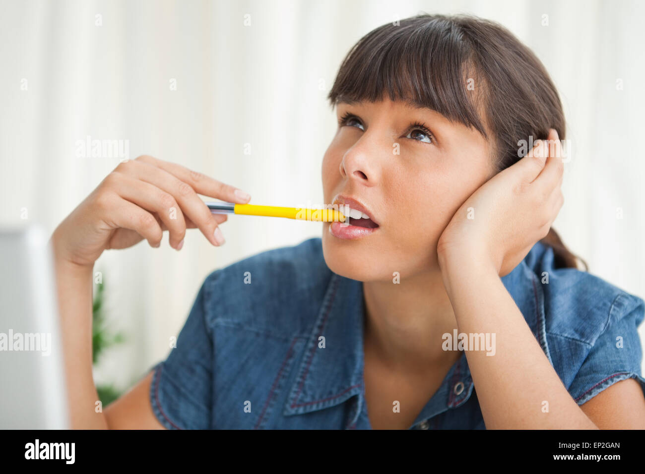 Student scratching her head for this homework Stock Photo - Alamy