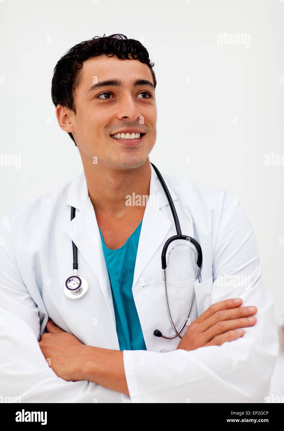 Attractive male doctor smiling at camera Stock Photo - Alamy