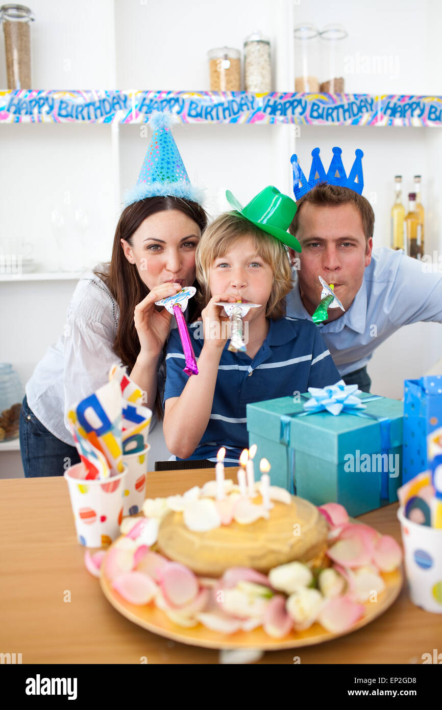 Joyful parents celebrating their son's birthday Stock Photo - Alamy