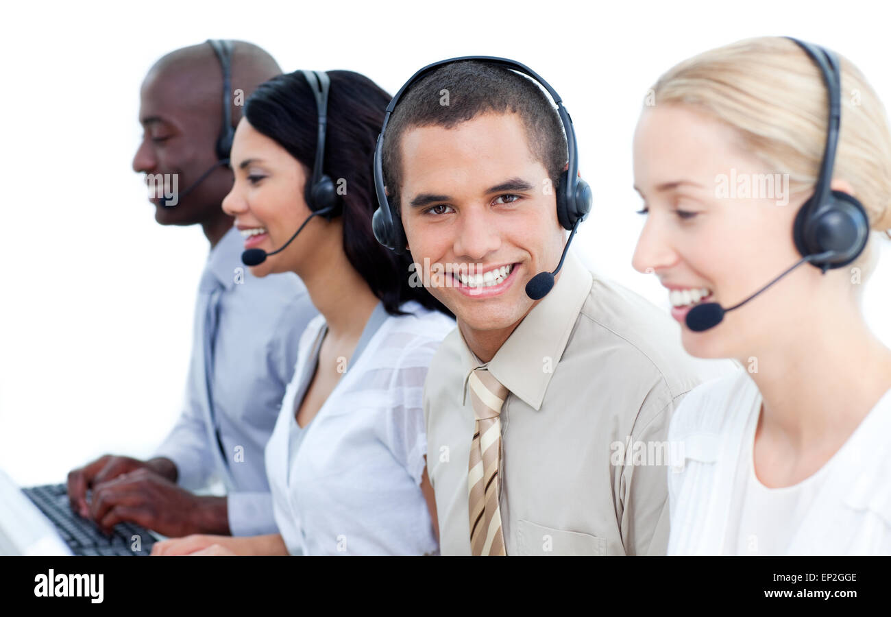 Smiling business team talking on headset in a call center Stock Photo ...