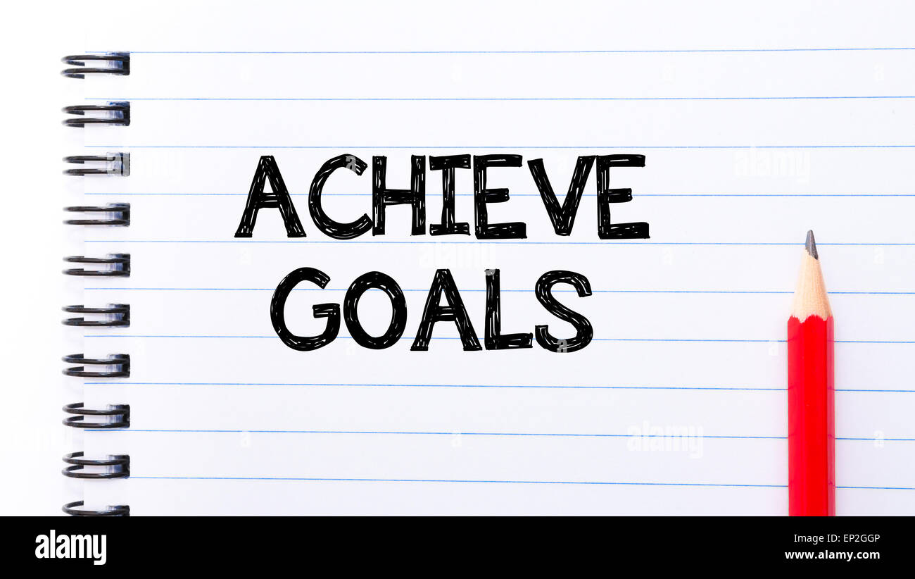 Achieve goals Text written on notebook page, red pencil on the right ...