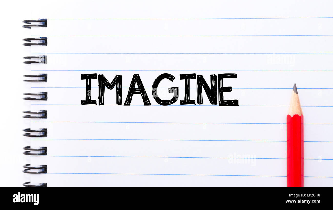 Imagine Text written on notebook page, red pencil on the right ...