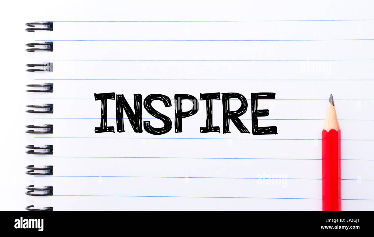 Inspire Text written on notebook page, red pencil on the right ...