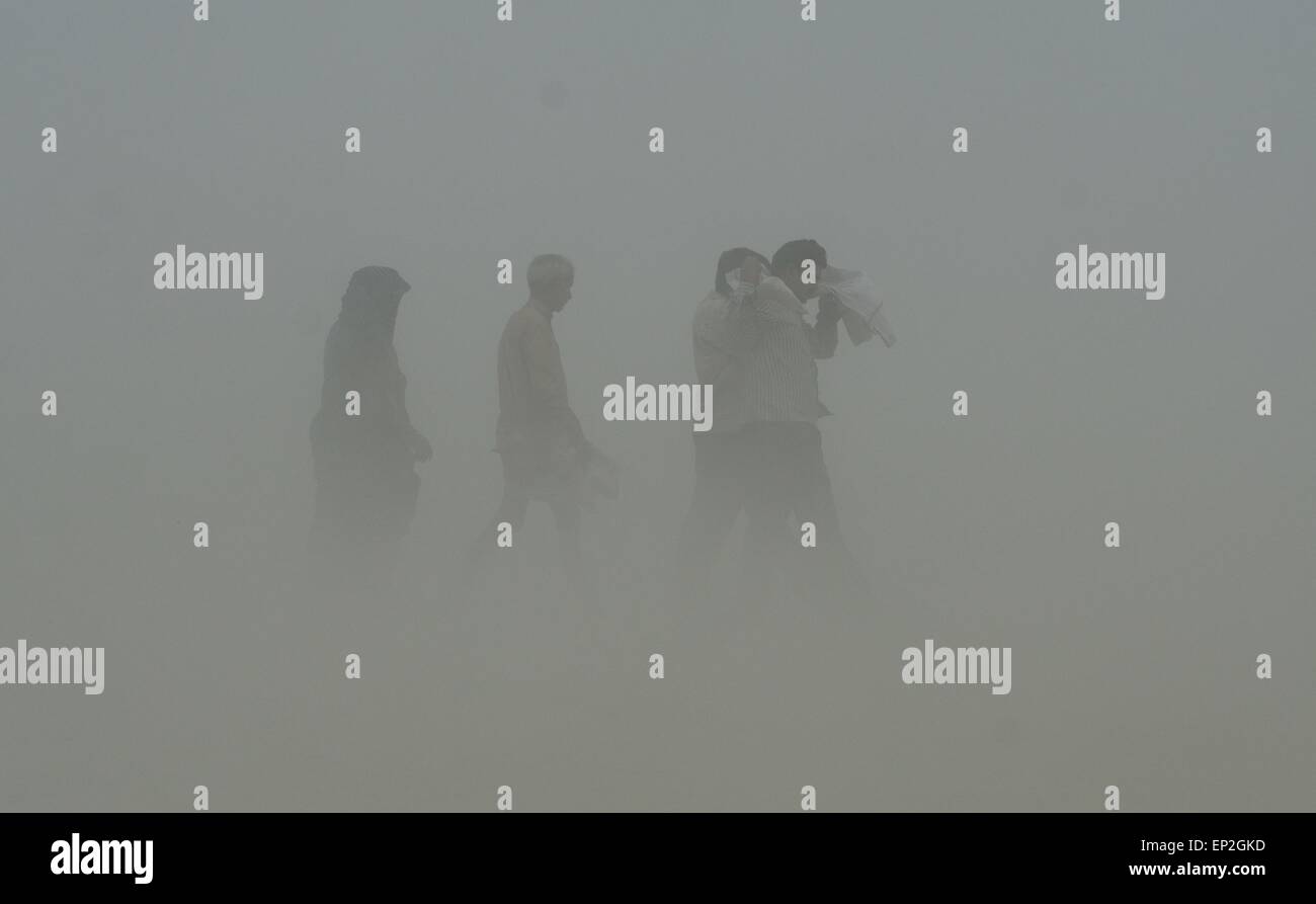 Allahabad, India. 13th May, 2015. Devotees walk trough dust storm at ...