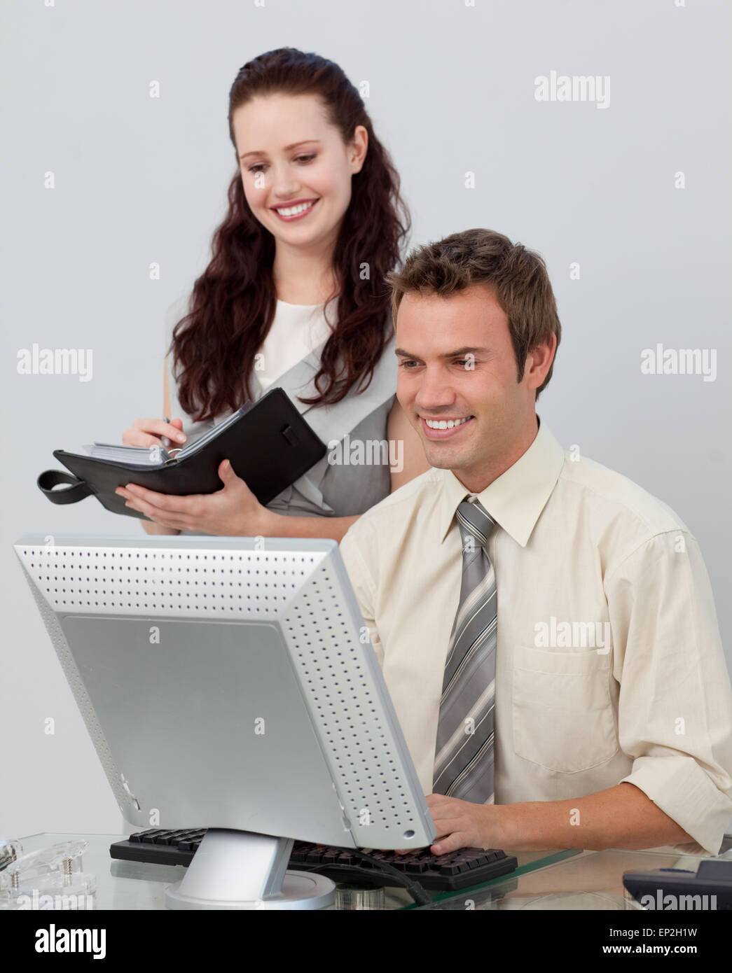 Assertive manager checking her employee's work Stock Photo - Alamy