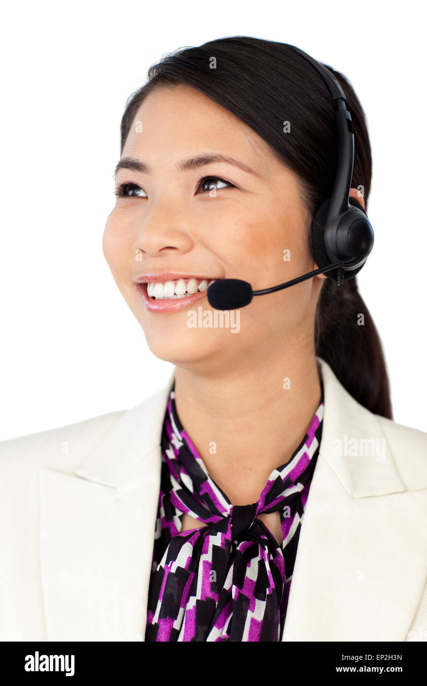 Young Asian customer service representative using headset isolated on a ...