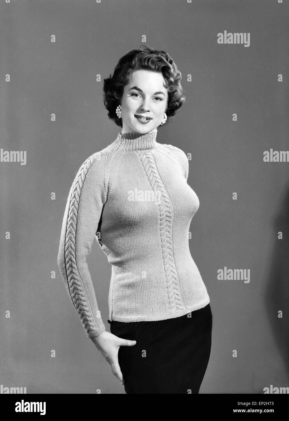 Clothing: Fashion: Knitwear: Model wearing jumper. 1955 Stock Photo - Alamy