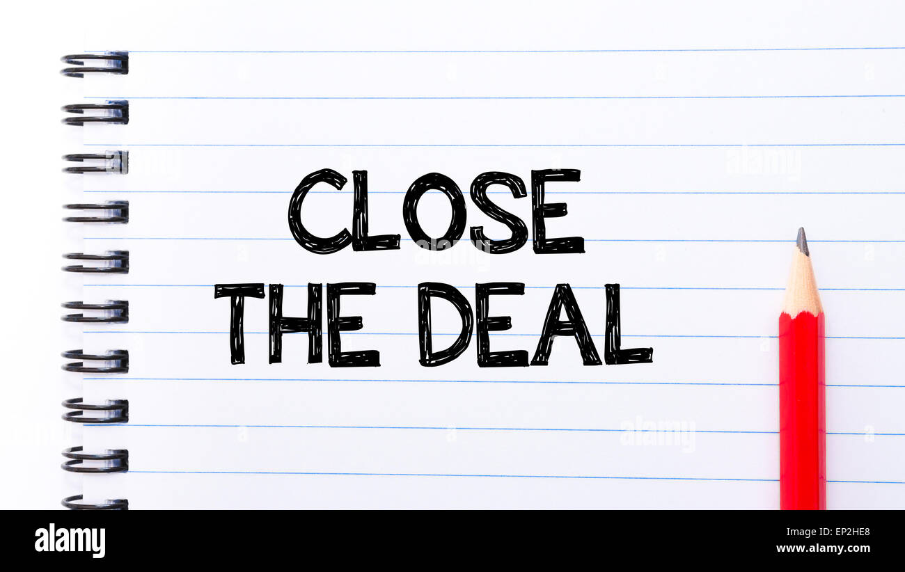 Close the Deal Text written on notebook page, red pencil on the right ...