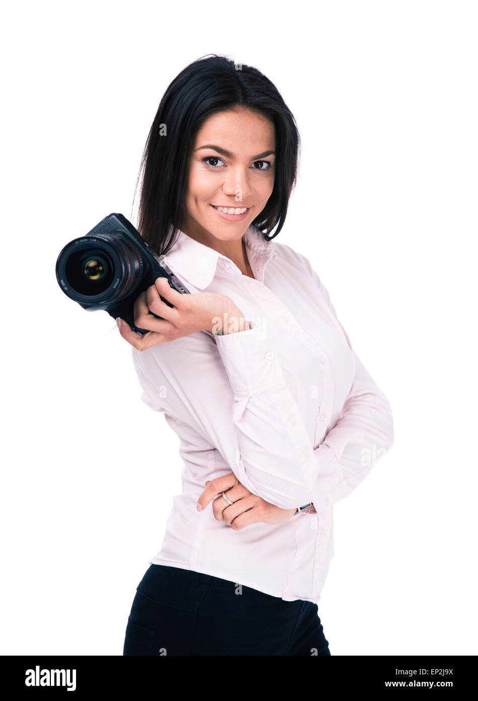 Smiling woman photographer holding camera isolated on a white ...