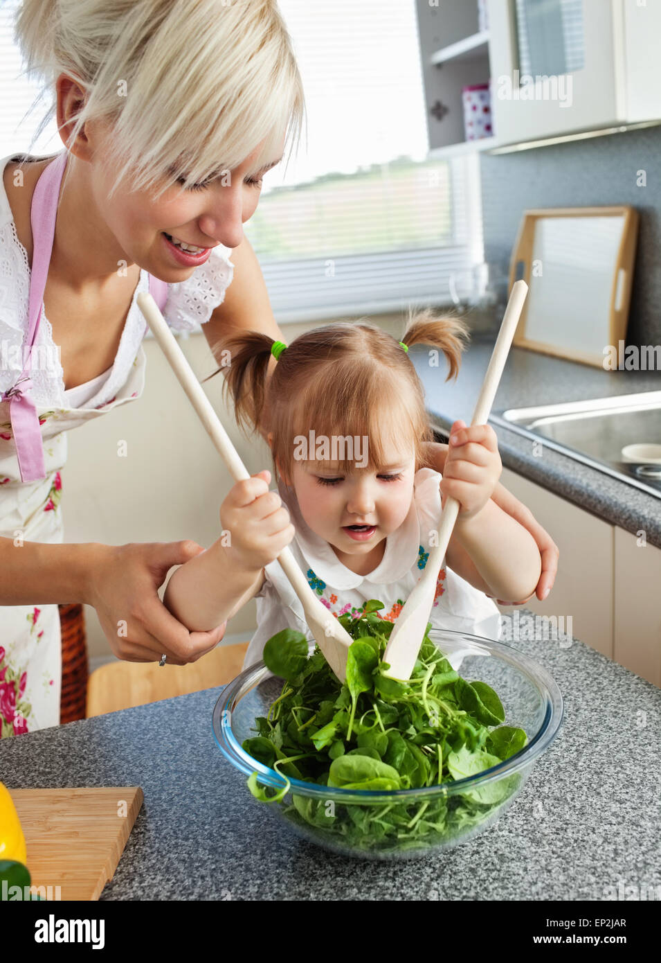 Bright mother and child cooking Stock Photo - Alamy