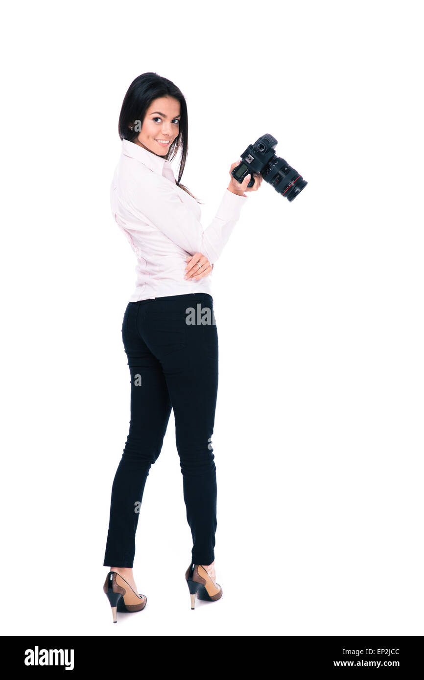 Back view portrait of a happy woman photographer looking at camera ...