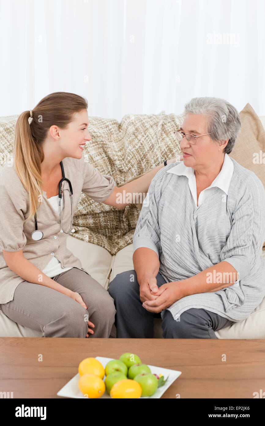 Nurse talking with her patient Stock Photo - Alamy