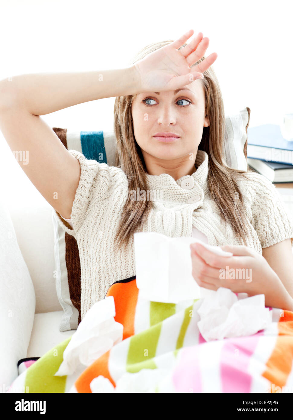 Sick young woman having fever lying on the sofa Stock Photo - Alamy