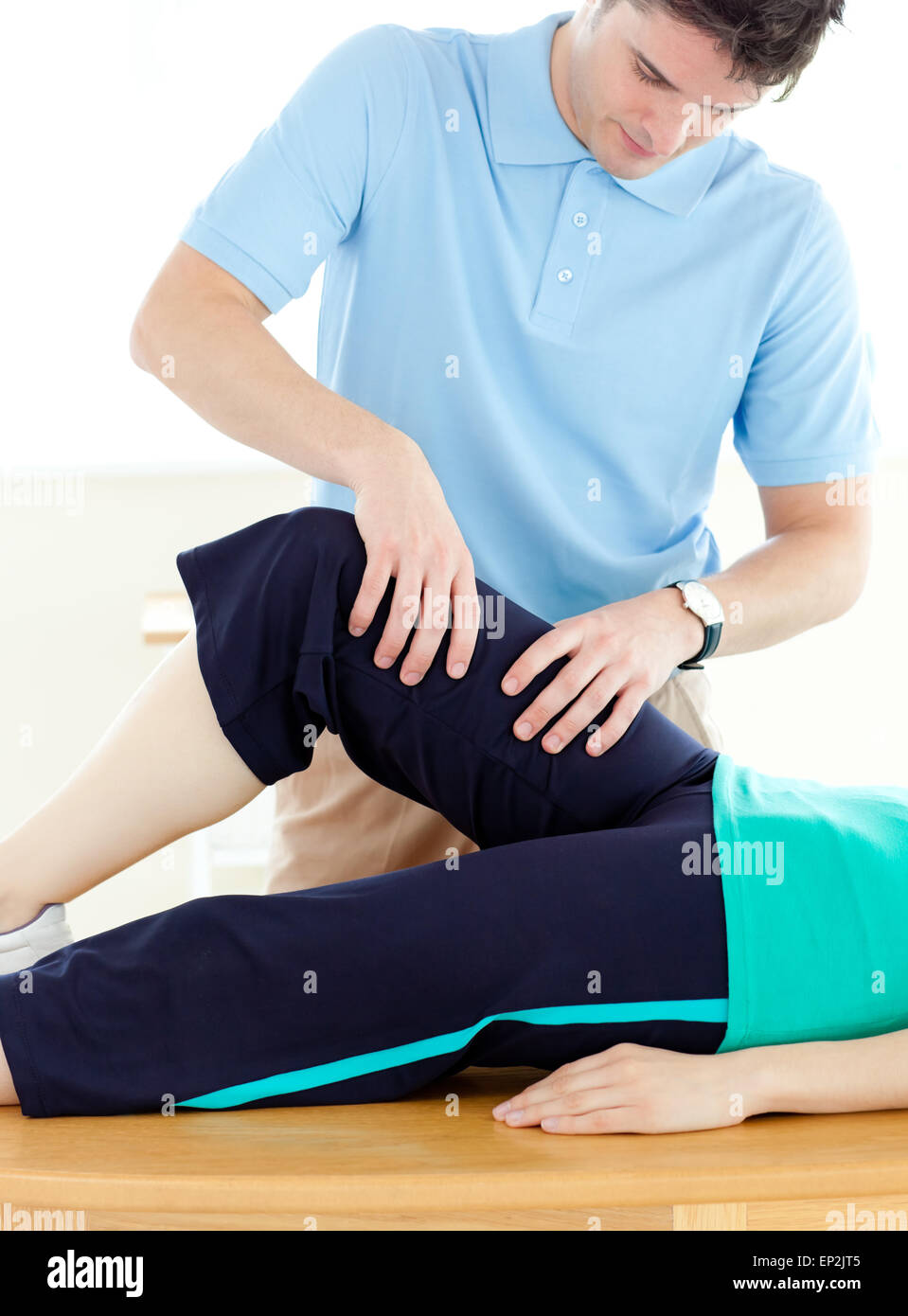 Young man doing fitness exercises with a patient in gym Stock Photo - Alamy