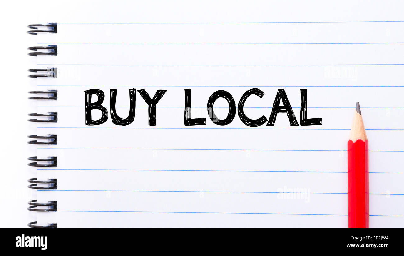 Buy Local Text written on notebook page, red pencil on the right ...