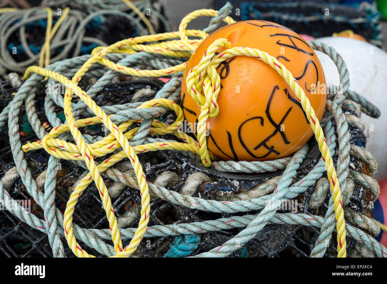 Fishing float with mooring rope industry fishing Stock Photo - Alamy