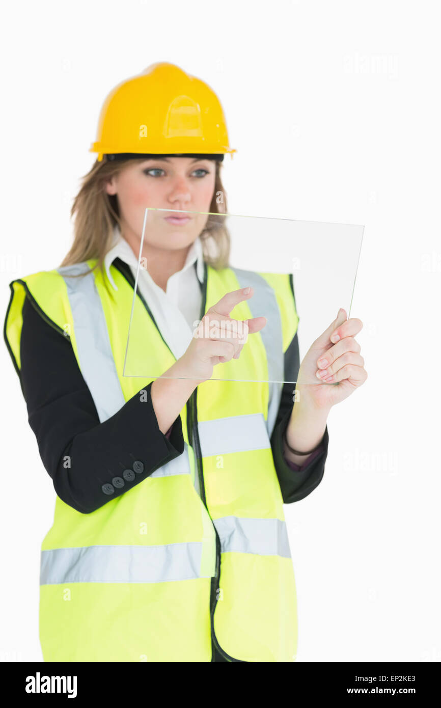 Female architect pressing something on a pane Stock Photo - Alamy