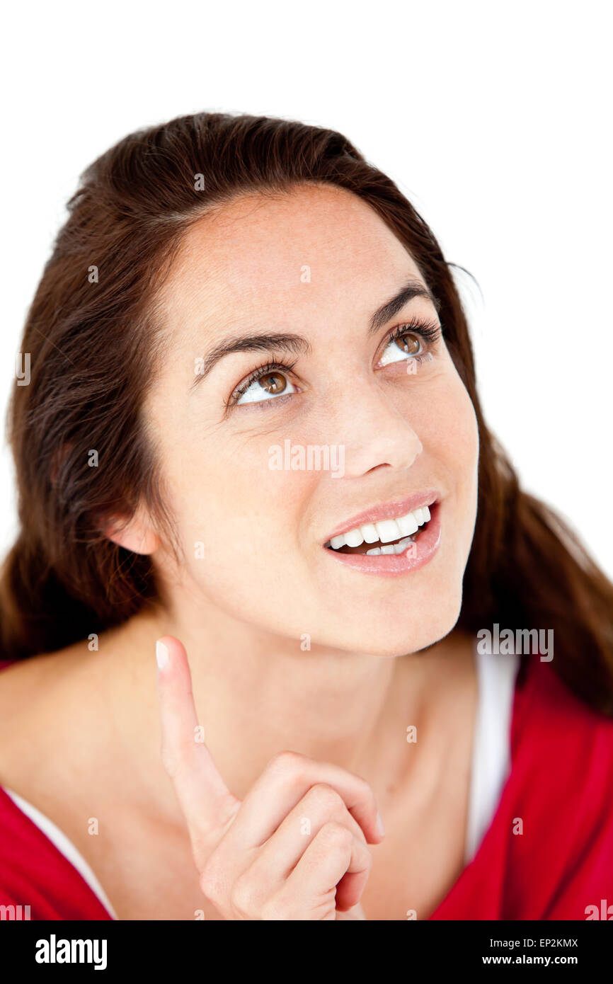 Portrait of a thoughtful hispanic woman pointing upward Stock Photo - Alamy