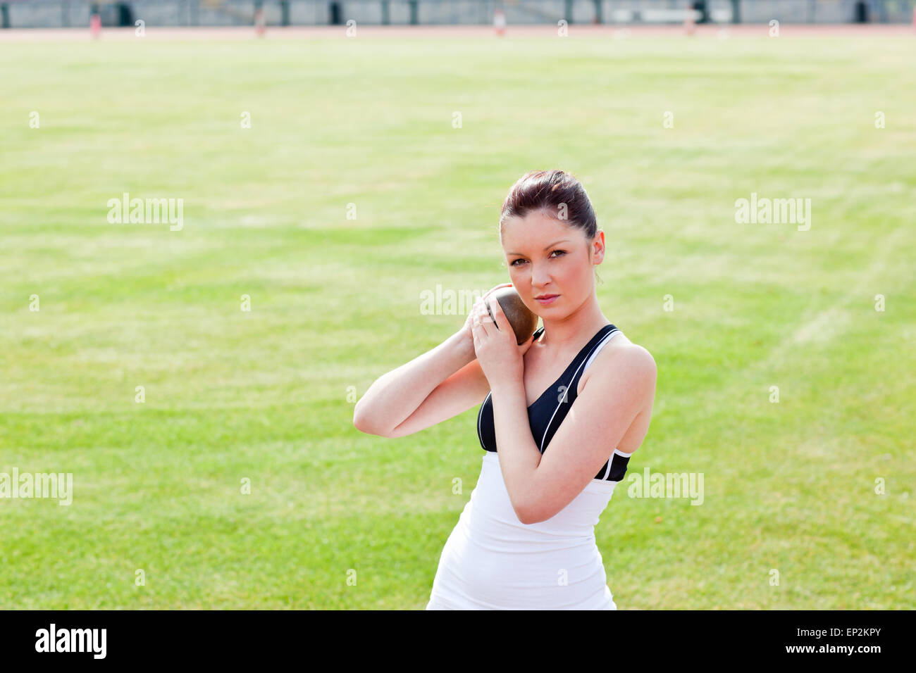 Determined female athlete holding weight Stock Photo - Alamy