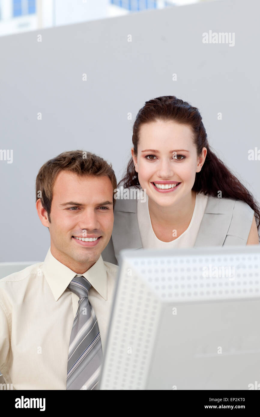 Assertive businesswoman helping her colleague Stock Photo - Alamy