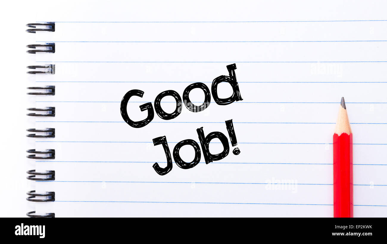 Good Job Text written on notebook page, red pencil on the right ...