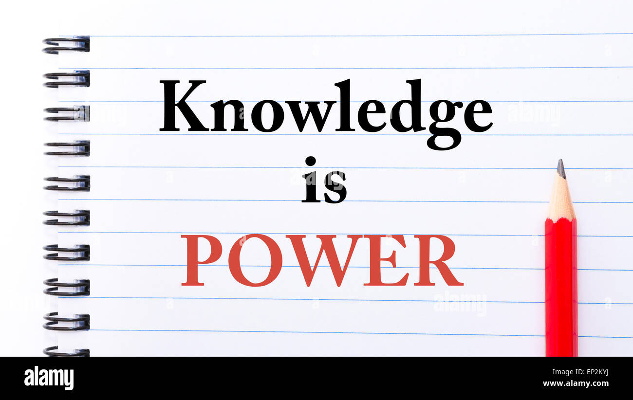 Knowledge is power Text written on notebook page, red pencil on the ...