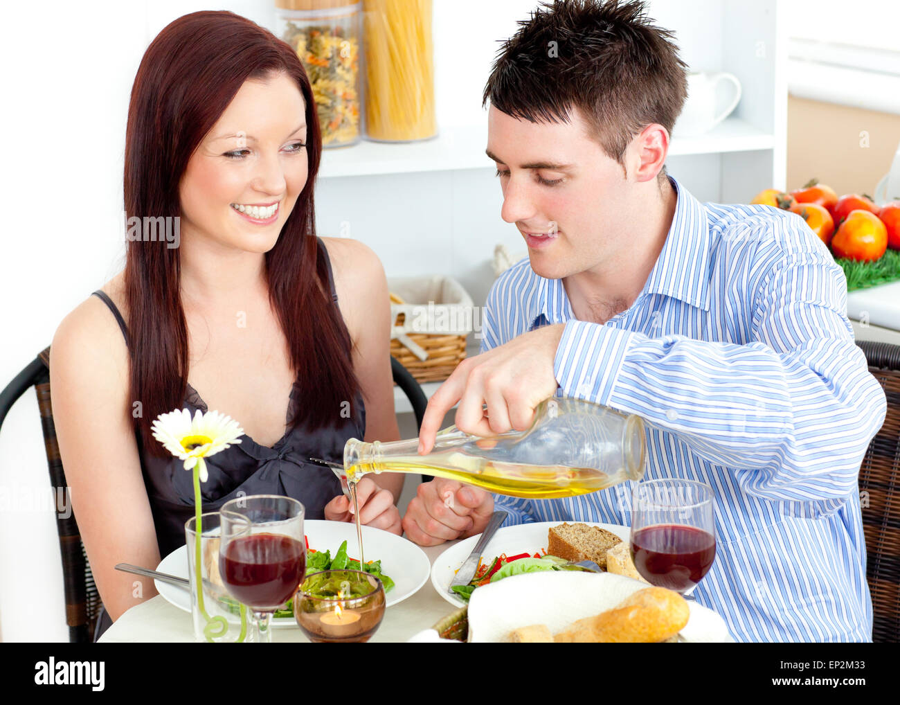 Radiant couple having dinner together in the kitchen at home Stock ...