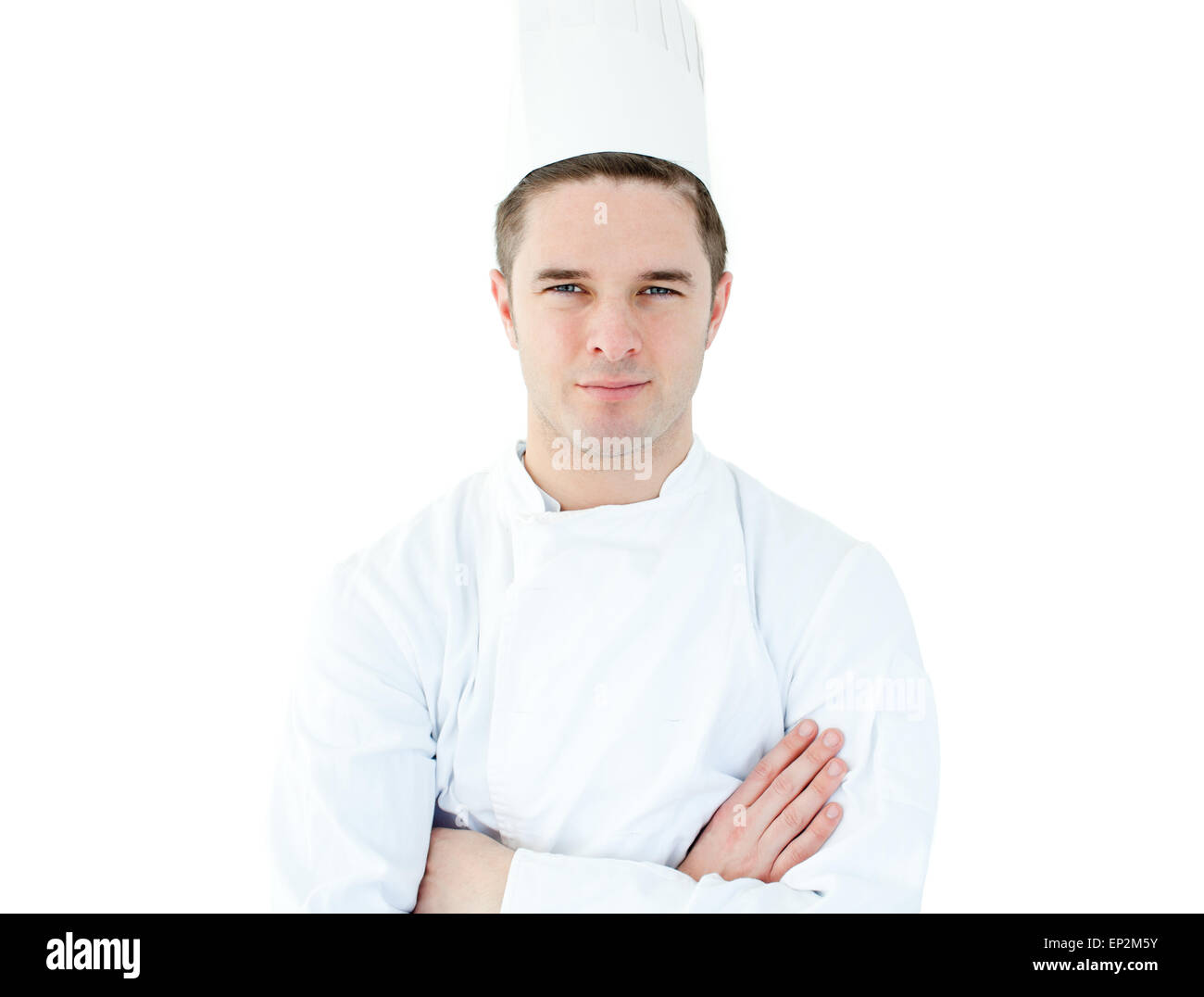 Attractive young chef with folded arms against white background Stock ...