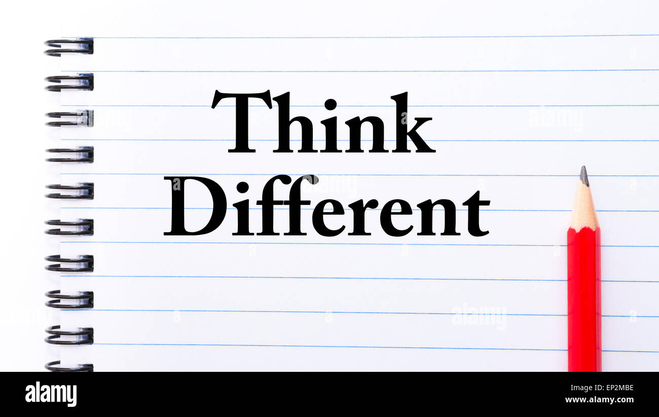 Think Different Text written on notebook page, red pencil on the right ...