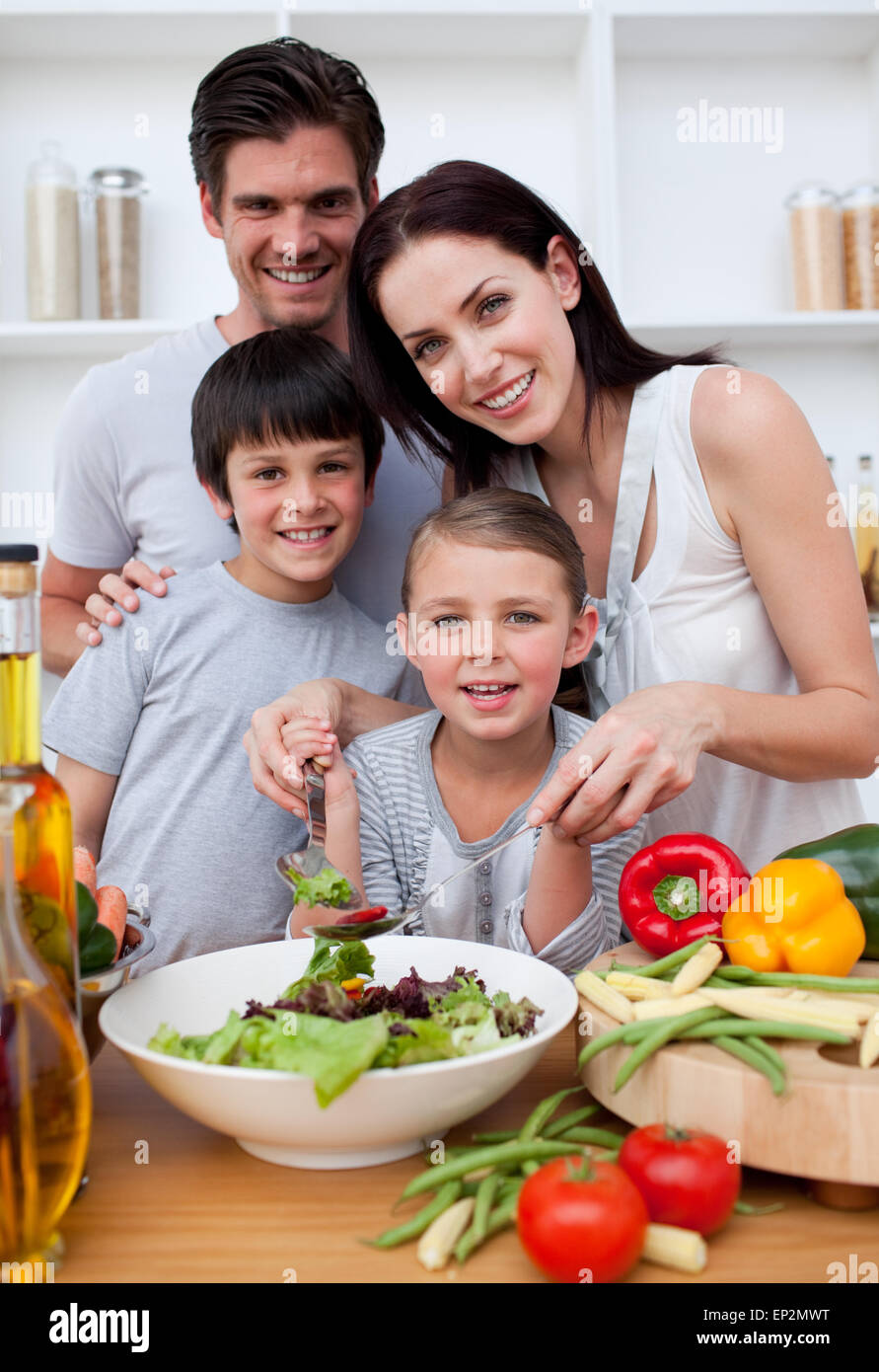 Smiling family cooking together Stock Photo - Alamy