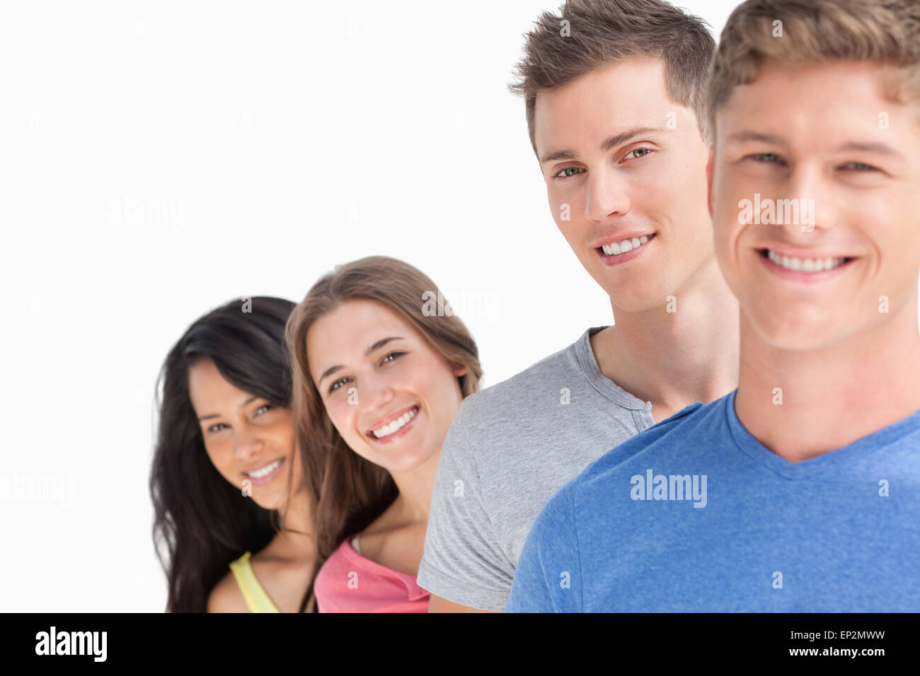 Four people standing one in front of the other with the girls heads ...