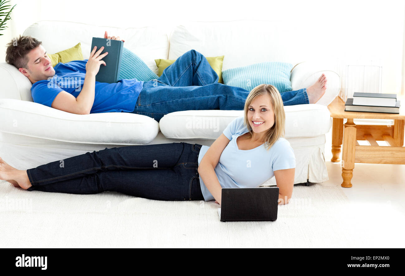 Happy couple having fun together in the living-room Stock Photo - Alamy