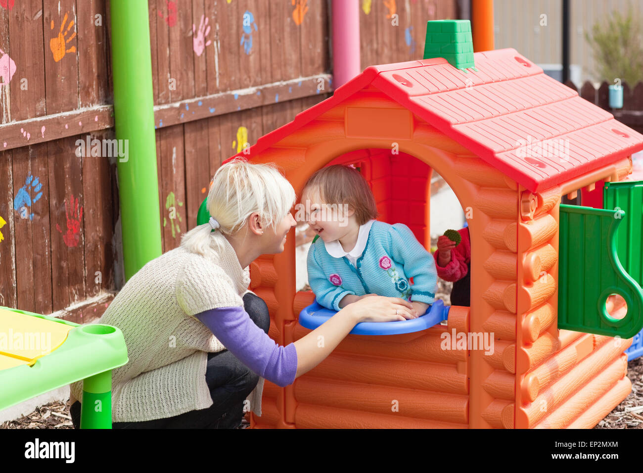 Smiling mother looking at her child Stock Photo - Alamy
