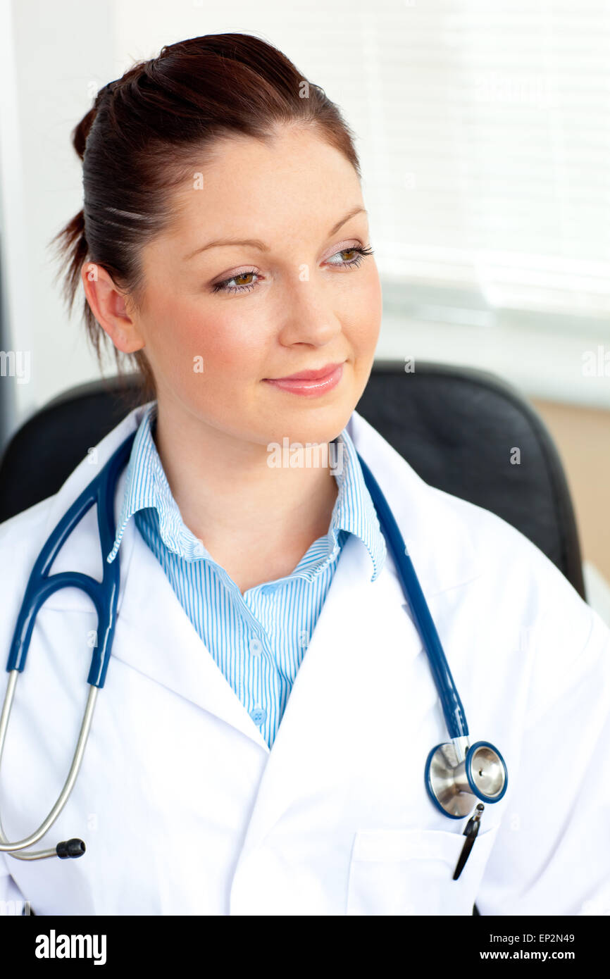 Confident female doctor sitting in her office Stock Photo - Alamy