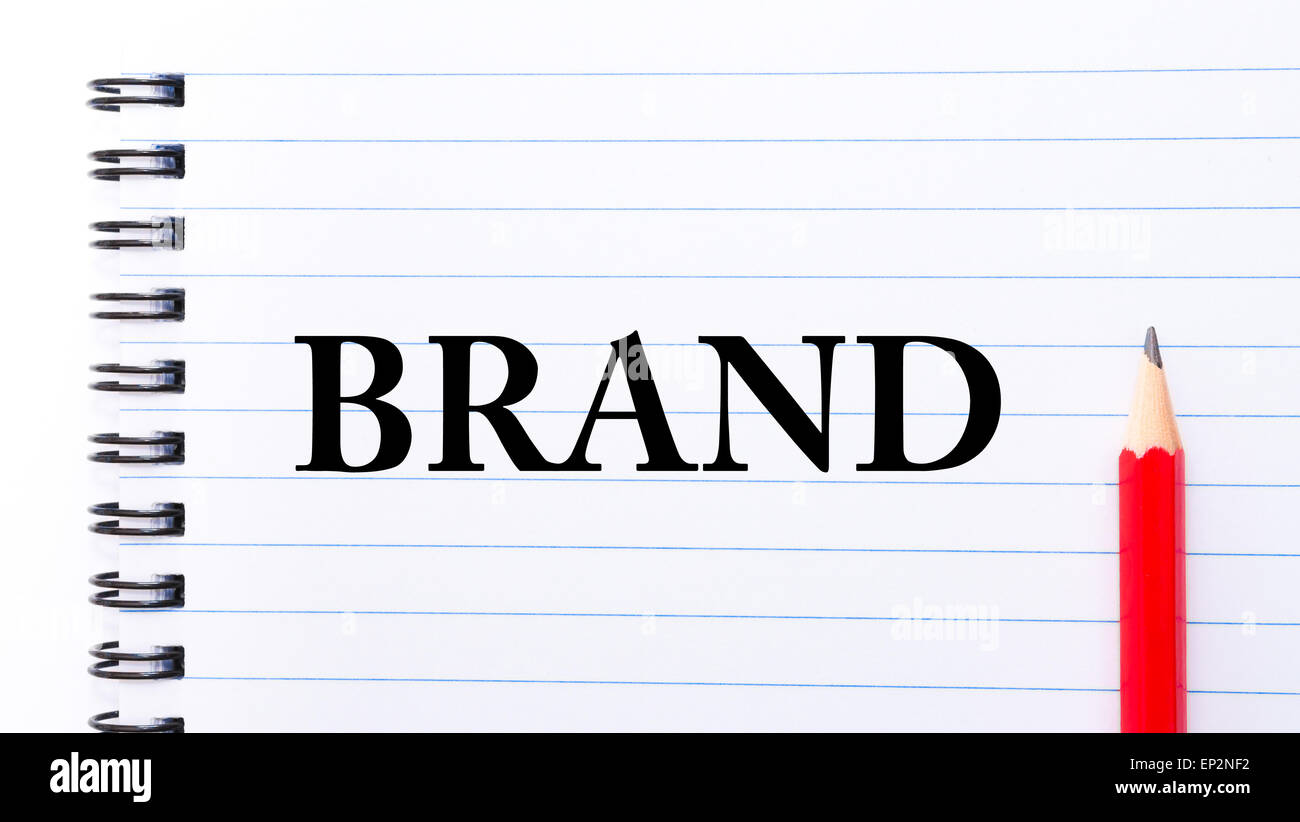 BRAND Text written on notebook page, red pencil on the right. Concept ...